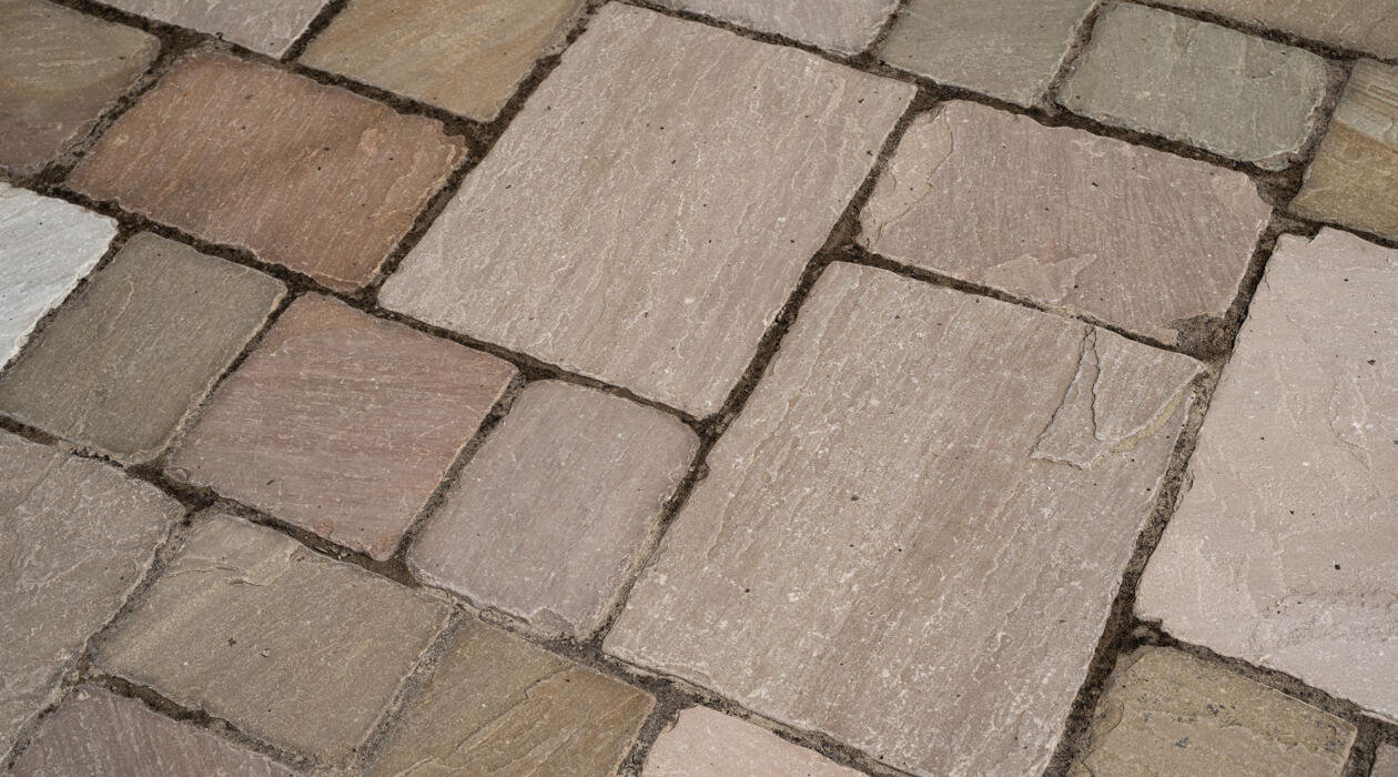 Raj Green Indian Sandstone Tumbled Cobble Paving from Stoneworld