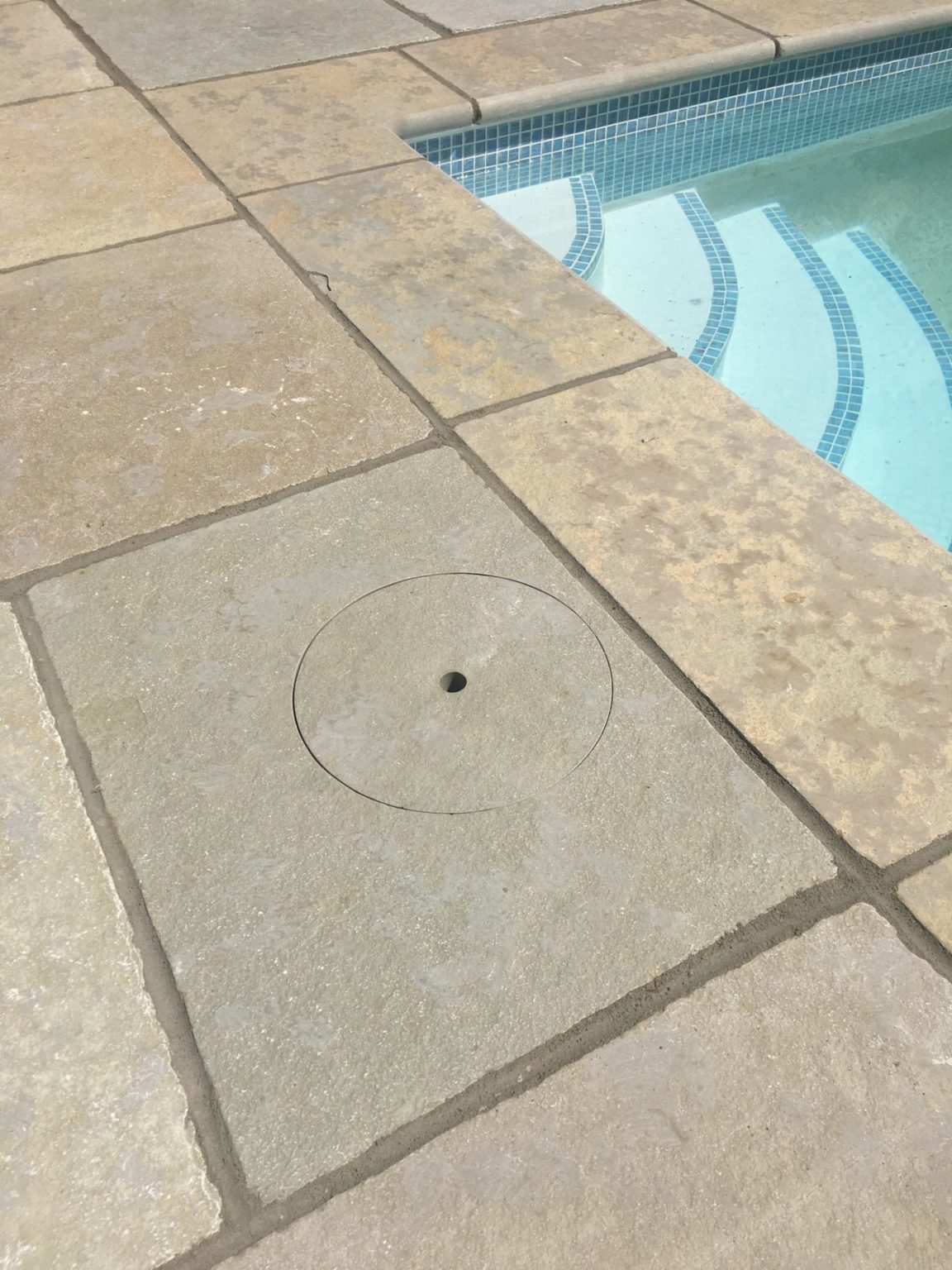 Enhance your pool with matching stone inspection lids - Stoneworld