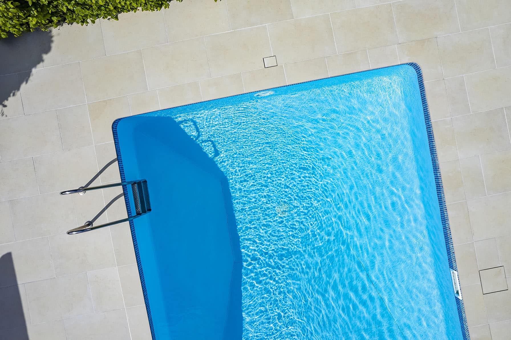 Enhance your pool with matching stone inspection lids - Stoneworld